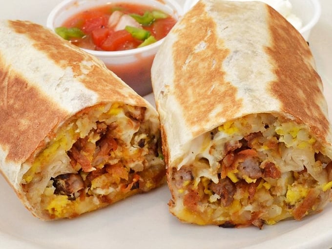 The legendary breakfast burrito in all its glory—a tortilla treasure chest filled with eggs, cheese, and morning magic that puts fancy brunch spots to shame.