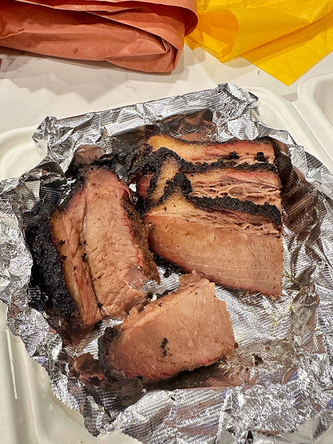 Brisket so tender it practically surrenders at the sight of your fork. That smoke ring isn't just for show—it's a flavor halo. 