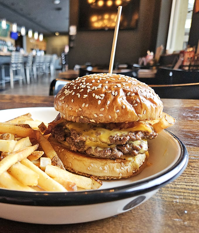 Behold the burger that launches a thousand road trips. That melty cheese cascade isn't just delicious – it's practically performance art.