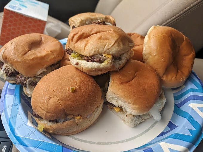 These aren't just burgers; they're edible history lessons. Small in stature but mighty in flavor, they demand to be ordered in multiples.