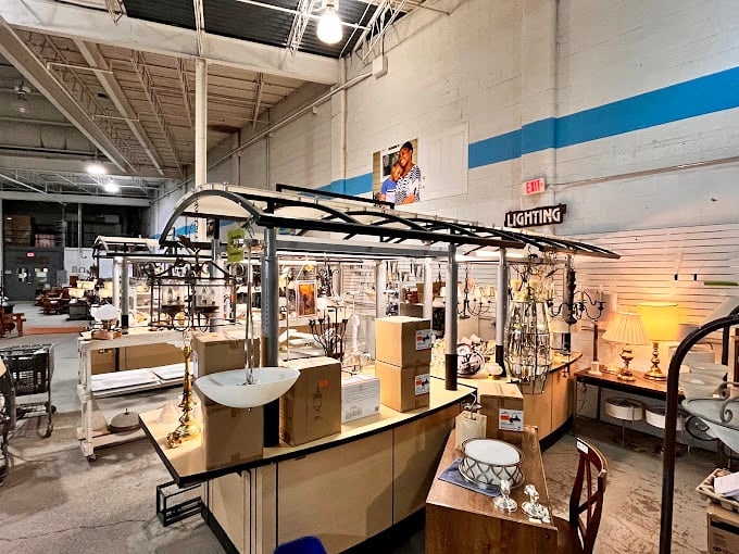The lighting section glows with possibility. These fixtures have stories to tell—some probably illuminated fascinating dinner conversations in their previous lives.