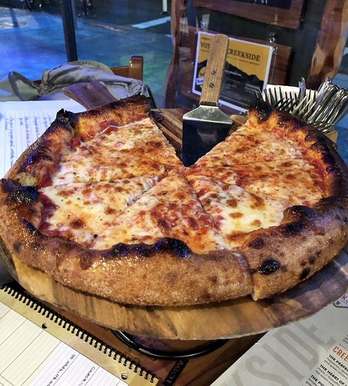 This isn't just cheese pizza – it's a masterclass in restraint, where perfect crust, sauce, and cheese achieve harmony without needing to show off.