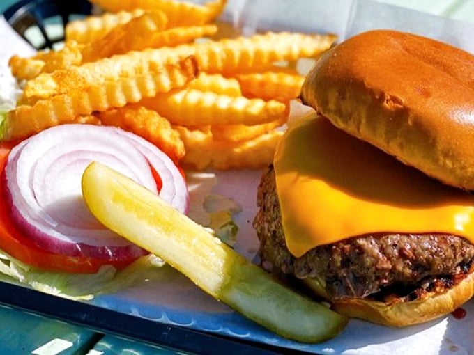 Behold the star of the show! This isn't just a cheeseburger—it's edible proof that sometimes the simplest pleasures deliver the most profound satisfaction.