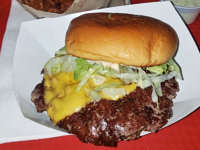 Behold the cheeseburger in its natural glory – a crusty-edged patty with melty cheese and fresh toppings that makes fast food chains weep with inadequacy.