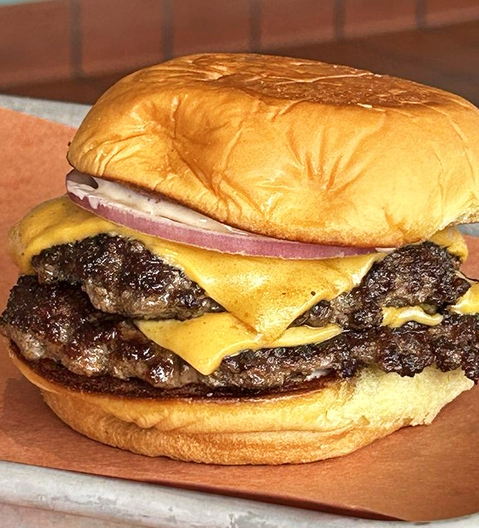 The cheeseburger that launched a thousand cravings. Two patties, melted American cheese, and a perfectly toasted bun—proof that simplicity, when done right, is revolutionary.