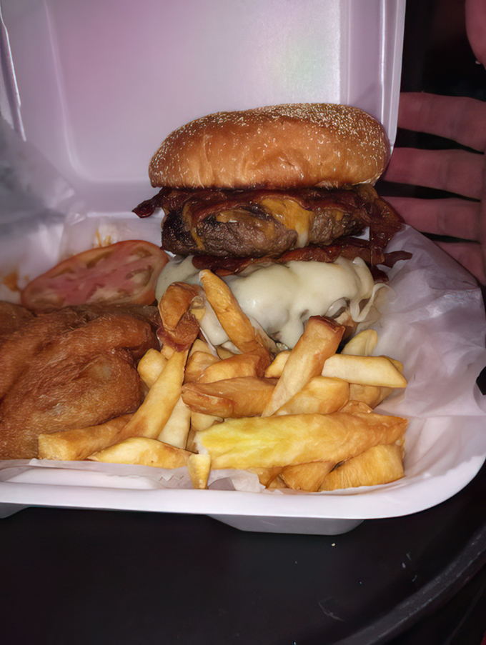 This isn't just a burger; it's a masterpiece of melted cheese cascading over a perfectly seared patty, with crispy bacon playing the supporting role it was born for.