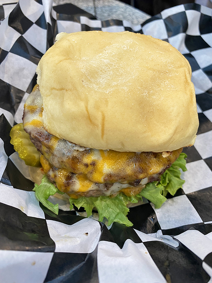 This isn't just a cheeseburger—it's edible architecture. The melted cheese cascades down like a yellow waterfall of happiness.