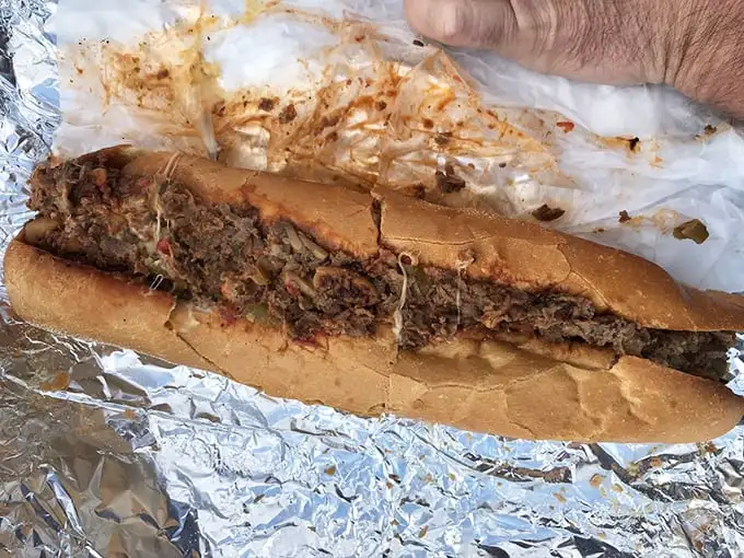 Behold the star of the show—a cheesesteak so perfectly balanced it might make Philadelphians question their loyalty. Those caramelized edges are pure magic.