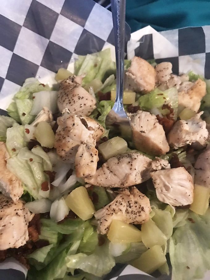 Fresh, tender chicken chunks nestled among crisp vegetables—proof that sometimes salads aren't just what food eats before becoming food.