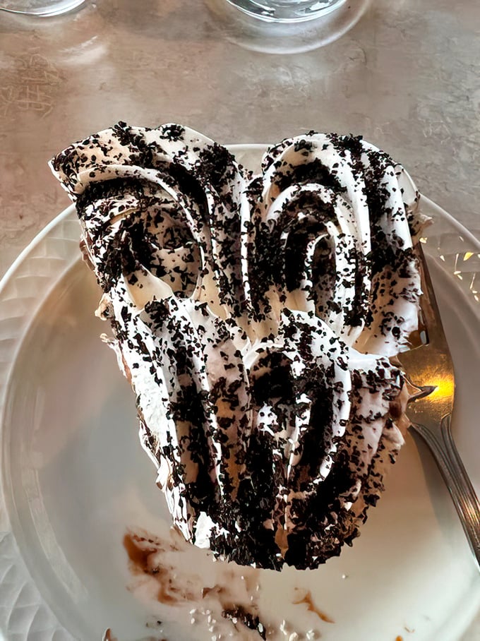 This chocolate cream pie looks like it moonlights as a cloud - fluffy, dramatic, and completely irresistible.