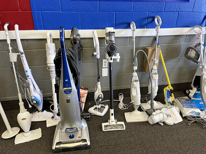 Vacuum cleaner battalion standing at attention! Each one with stories to tell and dust bunnies yet to conquer.