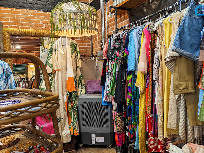 The clothing section bursts with color like your eccentric aunt's closet—each piece telling stories of decades past while promising new adventures ahead.