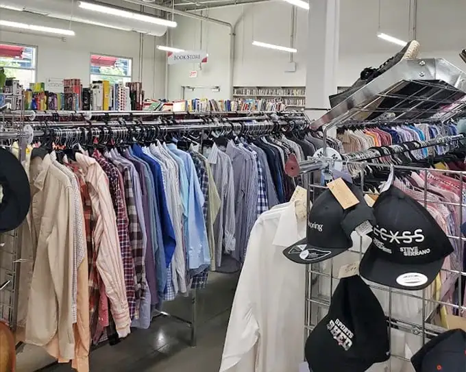 Men's shirts lined up like soldiers ready for inspection. That perfect Oxford button-down is hiding here somewhere, just waiting to upgrade your Zoom meeting game.