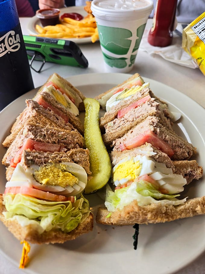 This club sandwich isn't just stacked—it's an architectural achievement with layers that tell a delicious story.