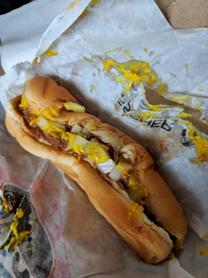 This coney dog isn't trying to impress Instagram—it's too busy being exactly what a proper Midwest hot dog should be: messy, mustard-laden perfection.
