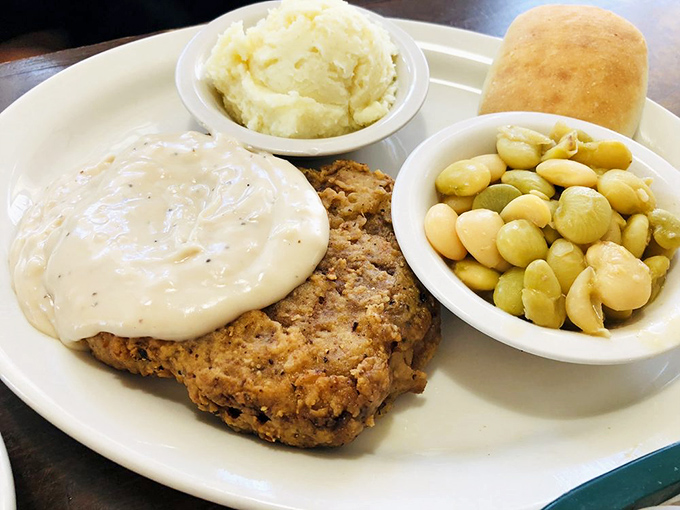 Country fried steak that could make a vegetarian weep with temptation. That pepper gravy blanket isn't just covering the steak—it's tucking it in for a flavor nap.