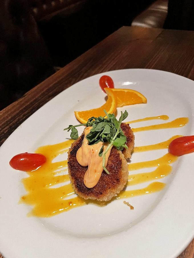 This crab cake arrives dressed to impress – golden, gorgeous, and ready for its close-up moment.