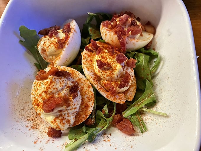 These aren't your grandmother's deviled eggs—unless your grandmother topped hers with crispy bacon and a sprinkle of spice that makes angels sing.