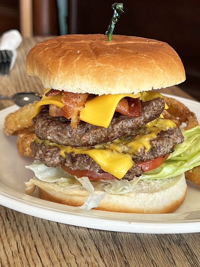 This isn't just a burger—it's an architectural masterpiece of beef, cheese, and bacon that demands both hands and your full attention.