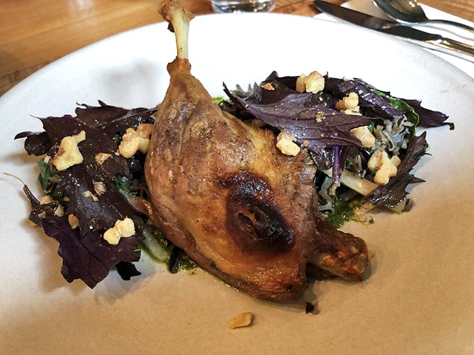 Duck confit that makes time stand still—crispy skin giving way to tender meat that practically melts. Worth crossing state lines for this bird.