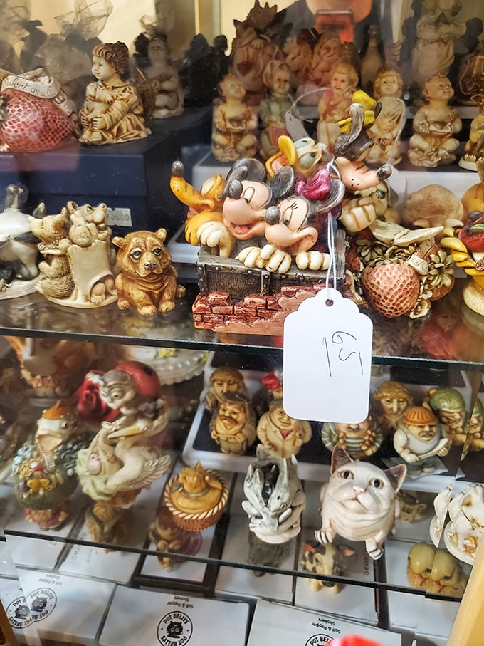 A miniature menagerie where Mickey Mouse rubs shoulders with porcelain cats and cherubic figurines. Marie Kondo would have a panic attack here.