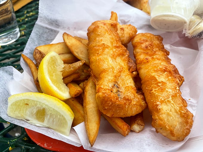 Golden-battered fish that shatters with each bite, paired with hand-cut fries and lemon wedges—seafood simplicity at its finest.