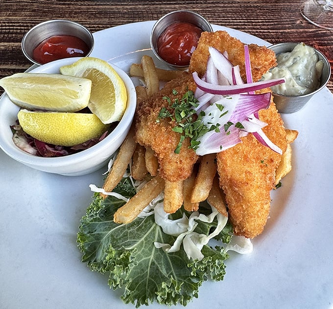 Golden-battered fish that shatters with each bite, served with fries that could make a Frenchman weep. The garnish isn't decoration—it's a vitamin supplement.
