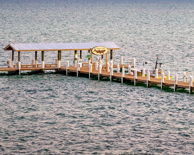 This fishing pier stretches toward the horizon like an invitation, promising adventures that don't require a single email check.