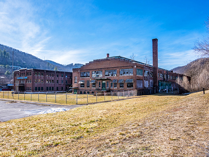Industrial heritage stands proud against mountain backdrops. This former factory building tells the story of Emporium's manufacturing past while mountains whisper promises of outdoor adventures.