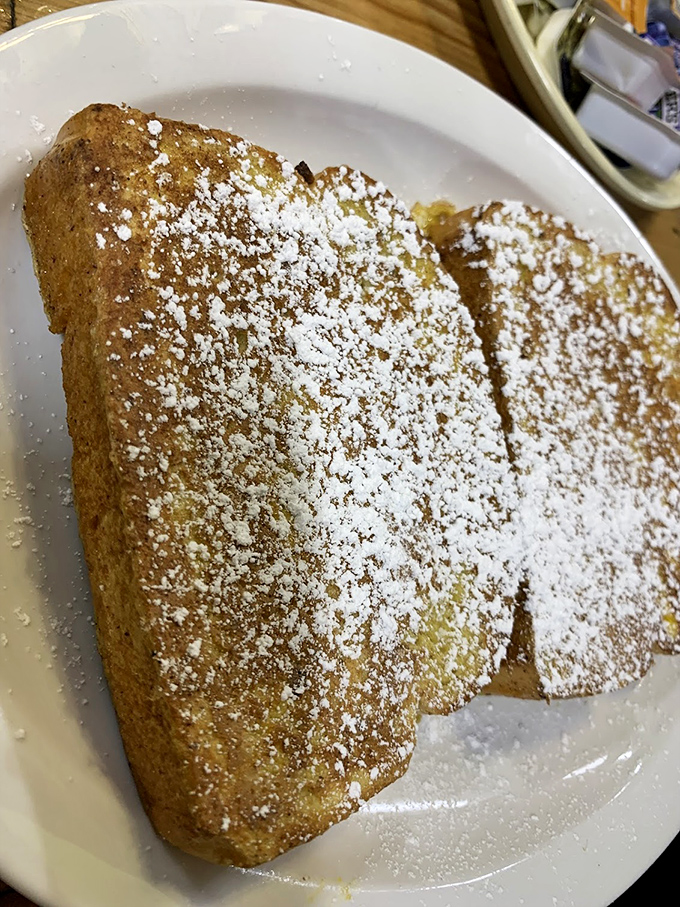Golden-brown perfection dusted with powdered sugar. This French toast doesn't need fancy toppings or Instagram filters – it's the breakfast equivalent of finding a unicorn.