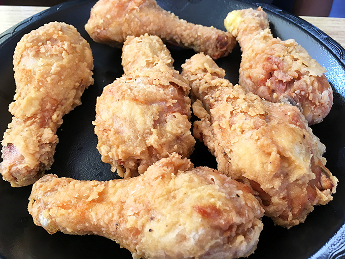 Golden armor protecting juicy treasure within. This isn't just fried chicken—it's edible nostalgia that makes conversation stop mid-sentence.