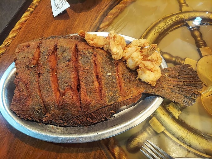 Behold the flounder that launched a thousand road trips – crispy, golden, and utterly magnificent.