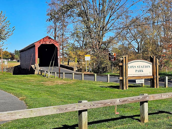 The park's welcome sign stands sentinel beside this historic gem. A reminder that some places are worth preserving for generations.