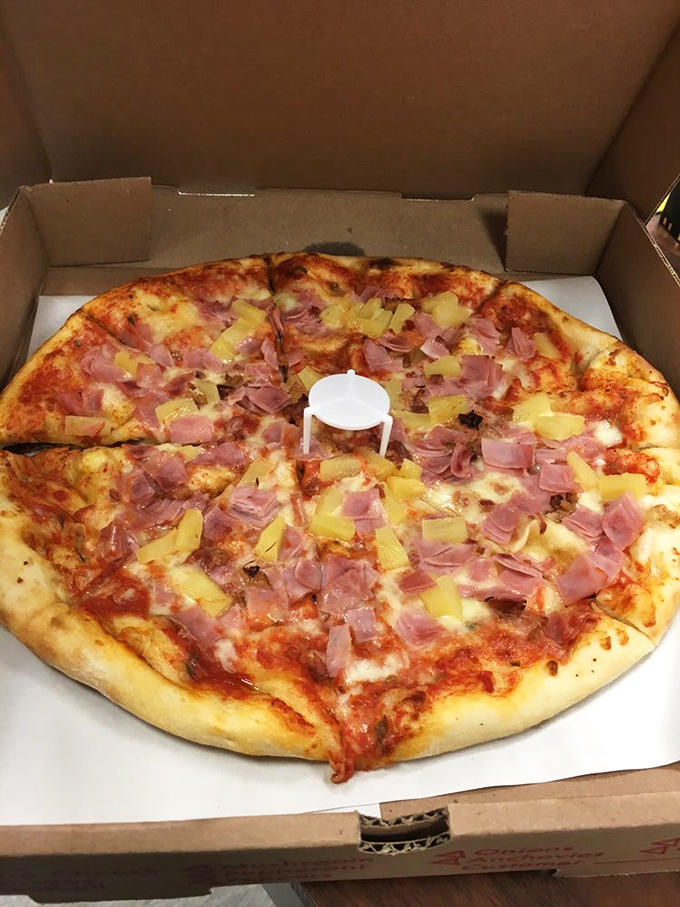 The Hawaiian pizza debate ends here. This perfect balance of salty ham and sweet pineapple would convert even the most dedicated pizza purists.