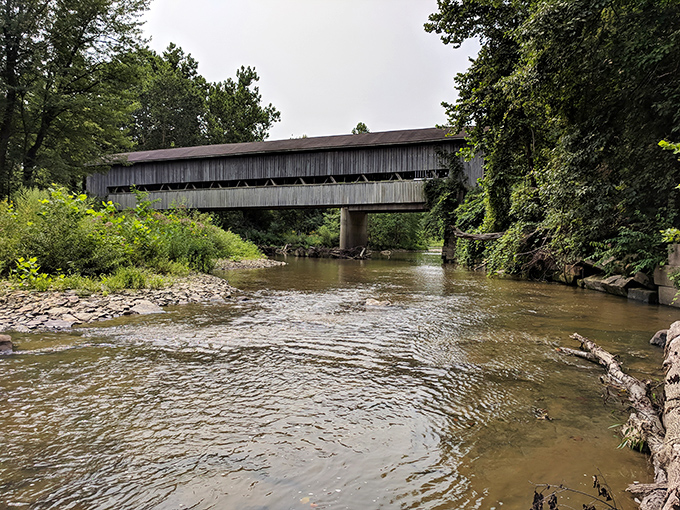 This covered bridge doesn't just span Conneaut Creek—it connects generations. Fishermen below hope for steelhead while the structure whispers 19th-century secrets.