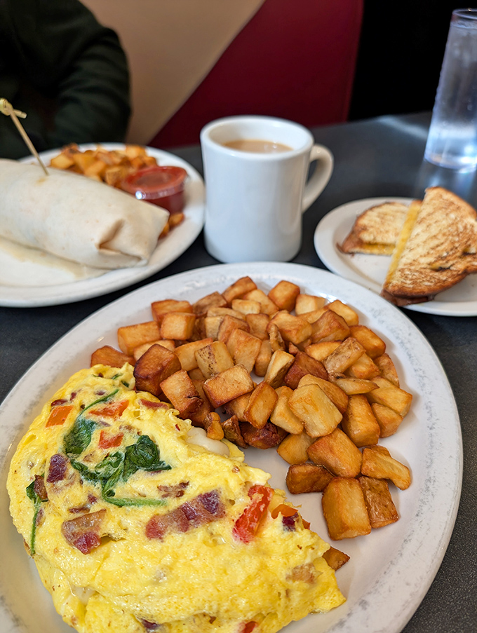 This omelet doesn't just satisfy hunger—it abolishes it. Paired with golden hash browns that crackle with each bite, it's morning perfection. 