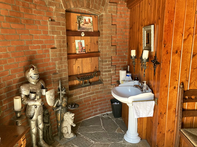Even knights need a throne room! The bathroom blends medieval charm with modern necessities—that suit of armor standing guard might make shy bladders a bit nervous.