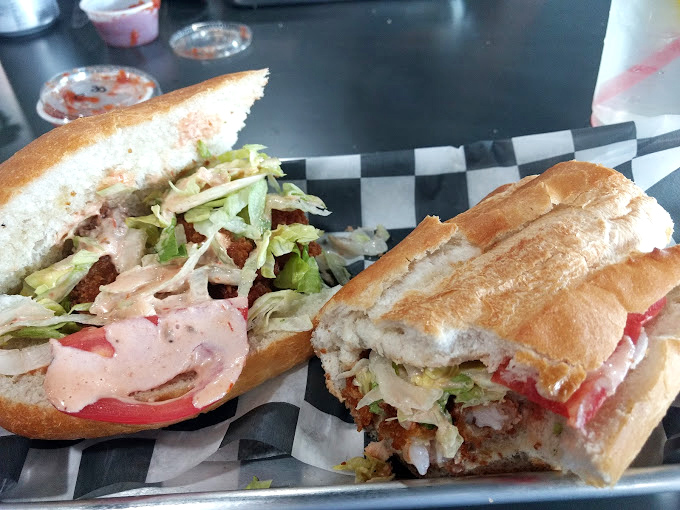 Behold the Italian hoagie in all its checkered-paper glory – this is what sandwich dreams are made of.