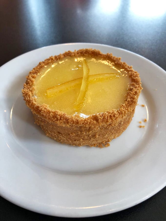 That lemon tart is sunshine on a plate – tart enough to make you pucker, sweet enough to make you smile.