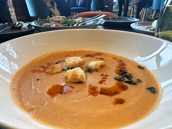 This lobster bisque isn't just soup—it's a warm hug in a bowl, with croutons playing the role of delicious life rafts.