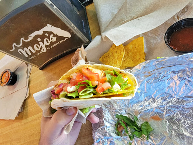 Fresh ingredients piled high on a proper tortilla—this isn't just a taco, it's edible architecture with a side of happiness.