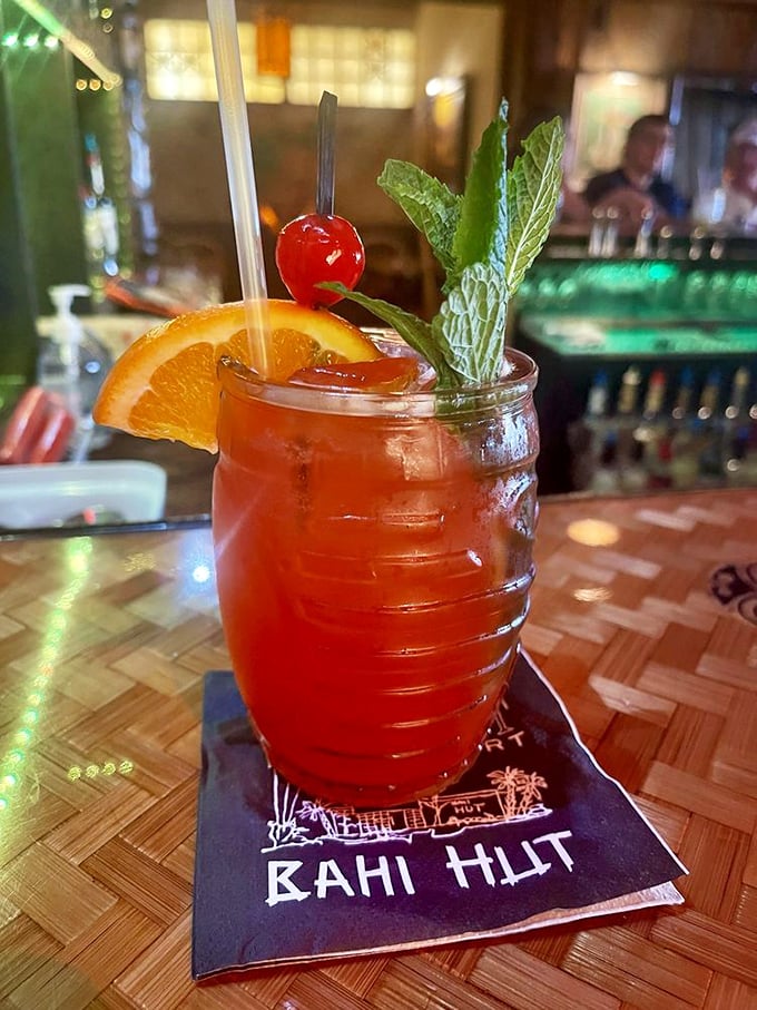 A perfectly crafted Mai Tai arrives with ceremonial garnishes that make every sip feel like vacation.