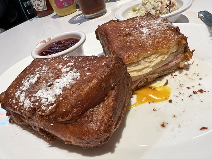 Behold the Monte Cristo: where French toast meets sandwich perfection in one glorious, syrup-drizzled masterpiece.