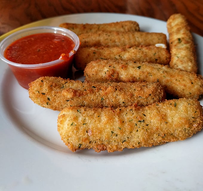 Golden-brown perfection with an audible crunch—these aren't just mozzarella sticks, they're the reason some people "forget" to share appetizers.