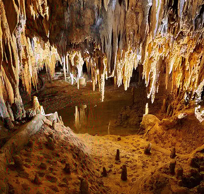 Nature's chandeliers hang in frozen majesty, each stalactite a testament to the power of persistence—one mineral-laden drop at a time.