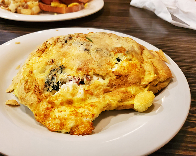 Not all heroes wear capes—some wear cheese. This omelet has more layers than your favorite mystery novel, each one more delicious than the last.