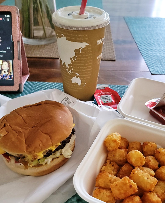 The burger-to-shake ratio here is perfectly calibrated for maximum happiness. Golden tater tots standing by for backup satisfaction.