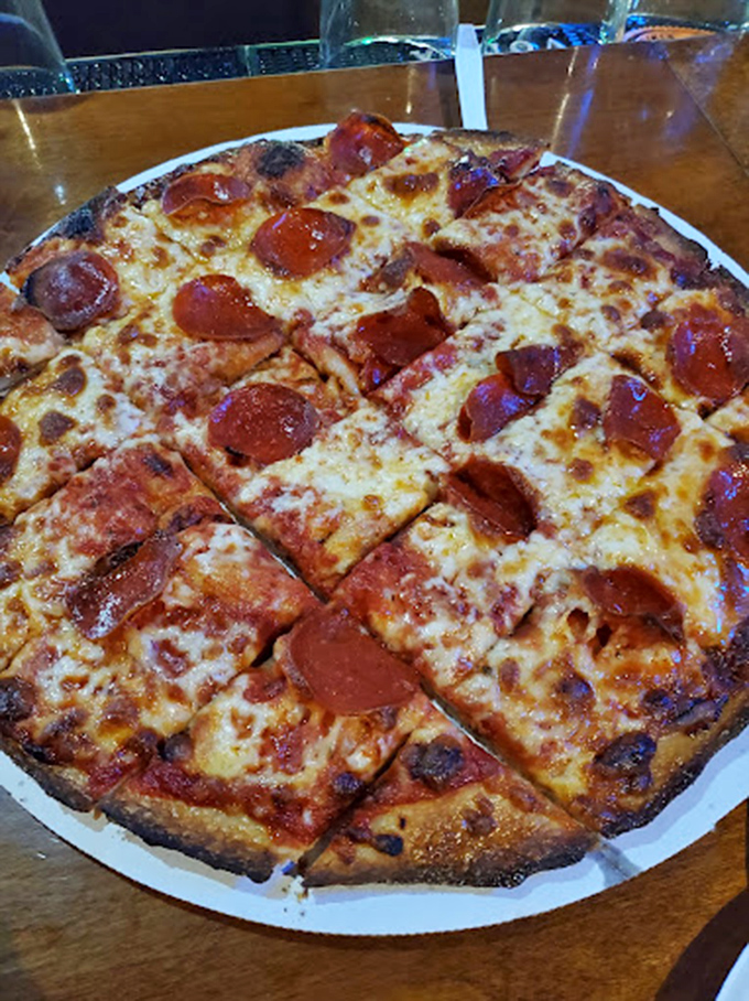 Pepperoni that curls into perfect little flavor cups, cheese that stretches for days. This isn't just pizza—it's edible architecture.