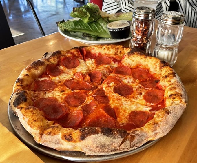 This isn't just pizza—it's a wood-fired canvas where pepperoni gets the smoky treatment usually reserved for brisket. Crispy, chewy, perfect.