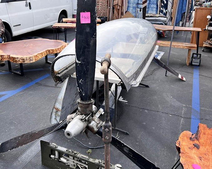Yesterday's engineering becomes today's conversation piece—this vintage propeller and mechanical parts represent the industrial treasures waiting to be repurposed.
